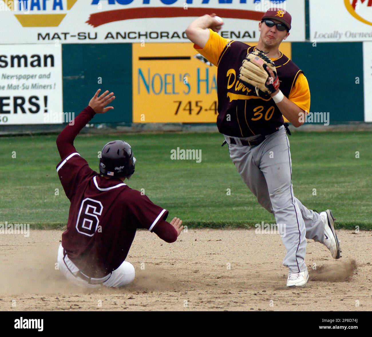Dimond's Cory Clevenger forces out Ketchikan's Jesse Lindgren (6) at ...