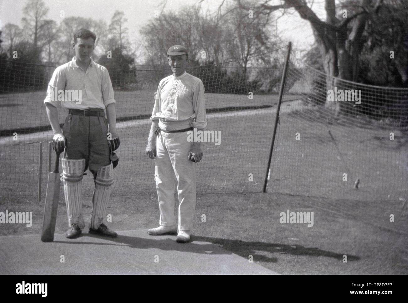 circa 1930s, historical, a young man wearing pads, gloves and holding a ...