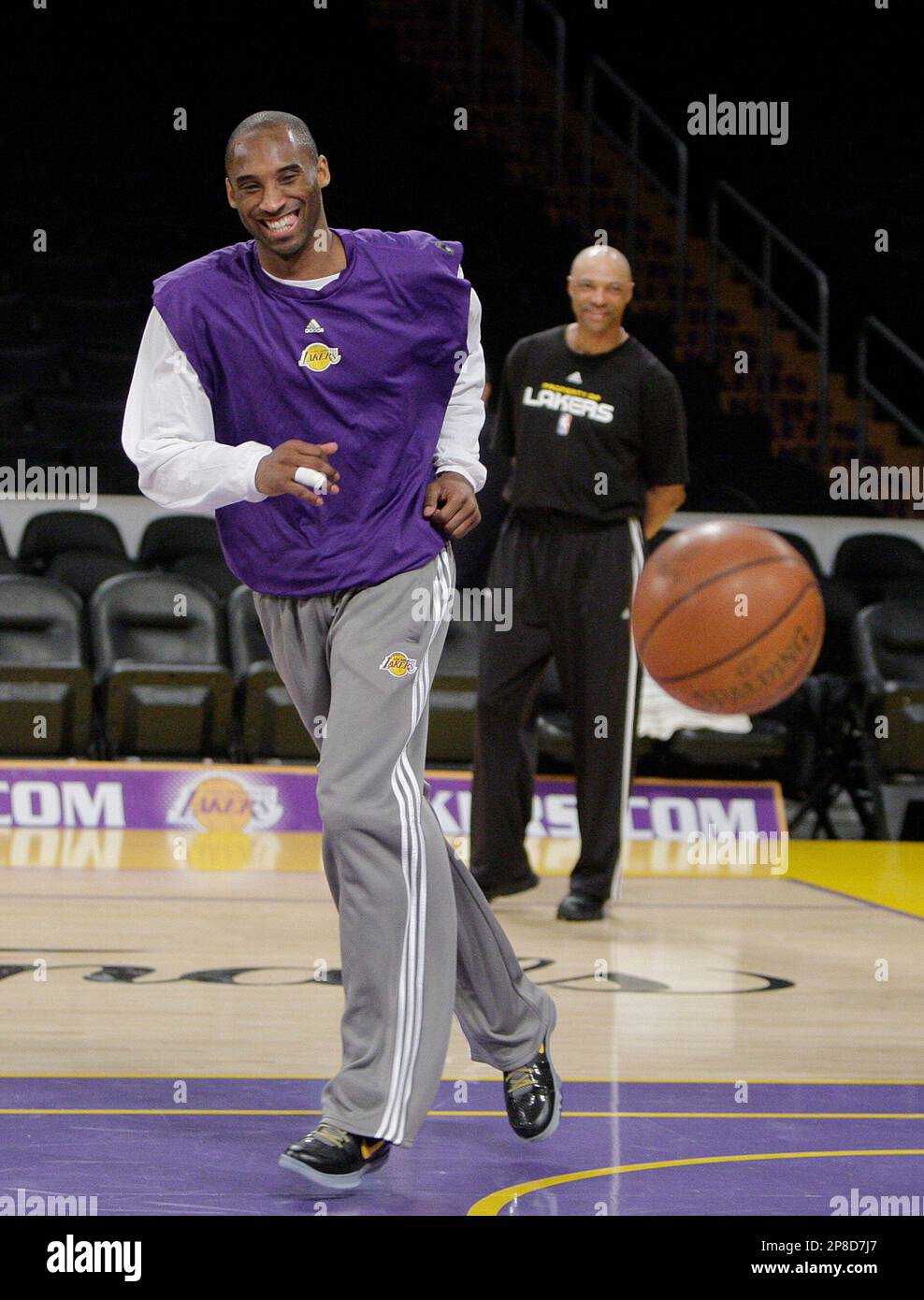 Los Angeles Lakers' Kobe Bryant goes after a ball during basketball ...