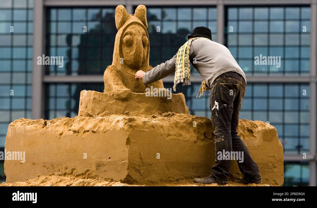 Patrick Steptoe from Britan works on a sculpture on the 7th ...