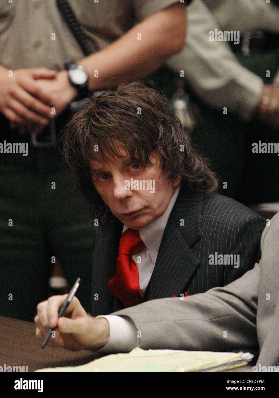 Music producer Phil Spector sits in a courtroom for his sentencing in ...
