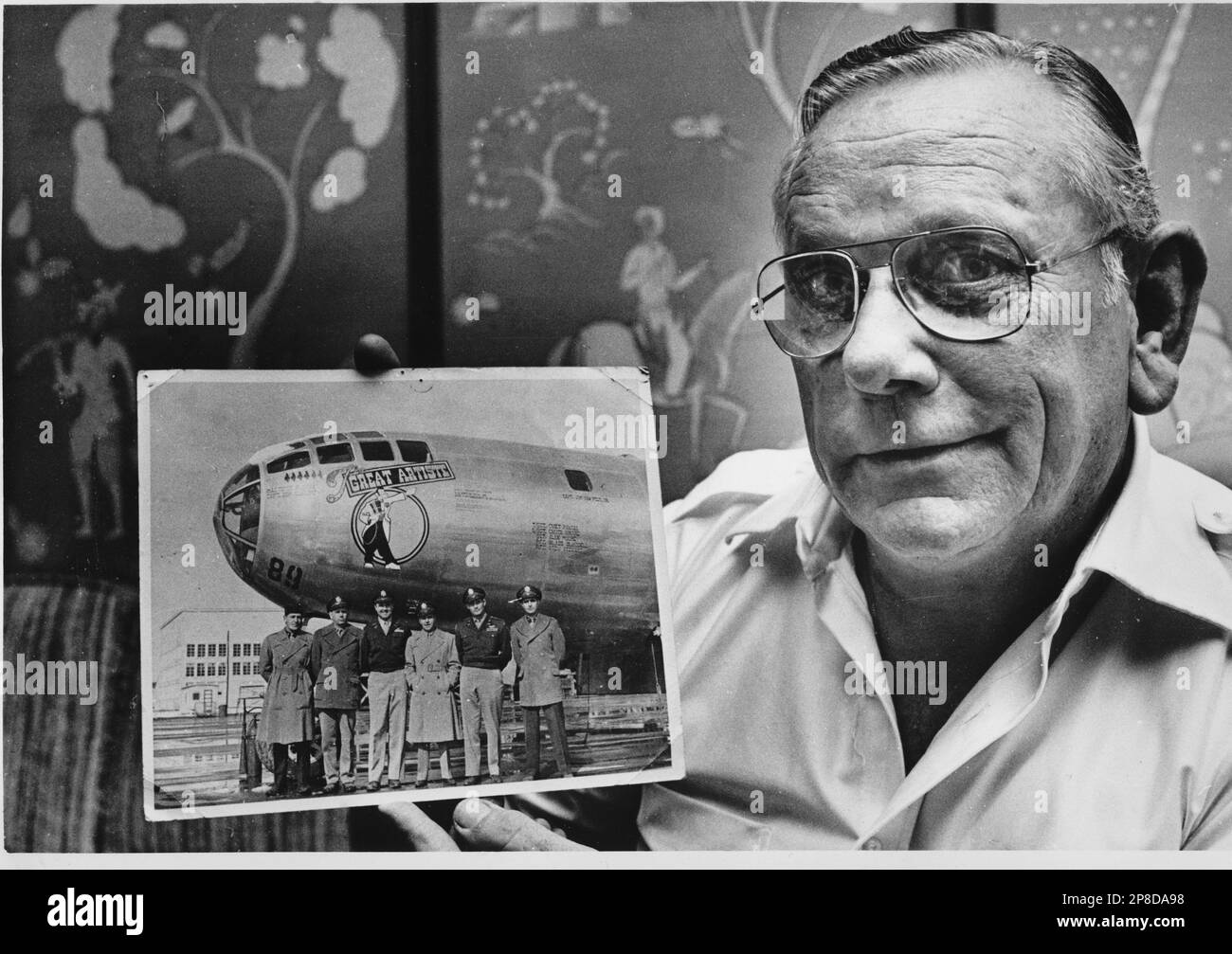File - Charles Donald Albury holds a picture of the B-29 bomber "The ...