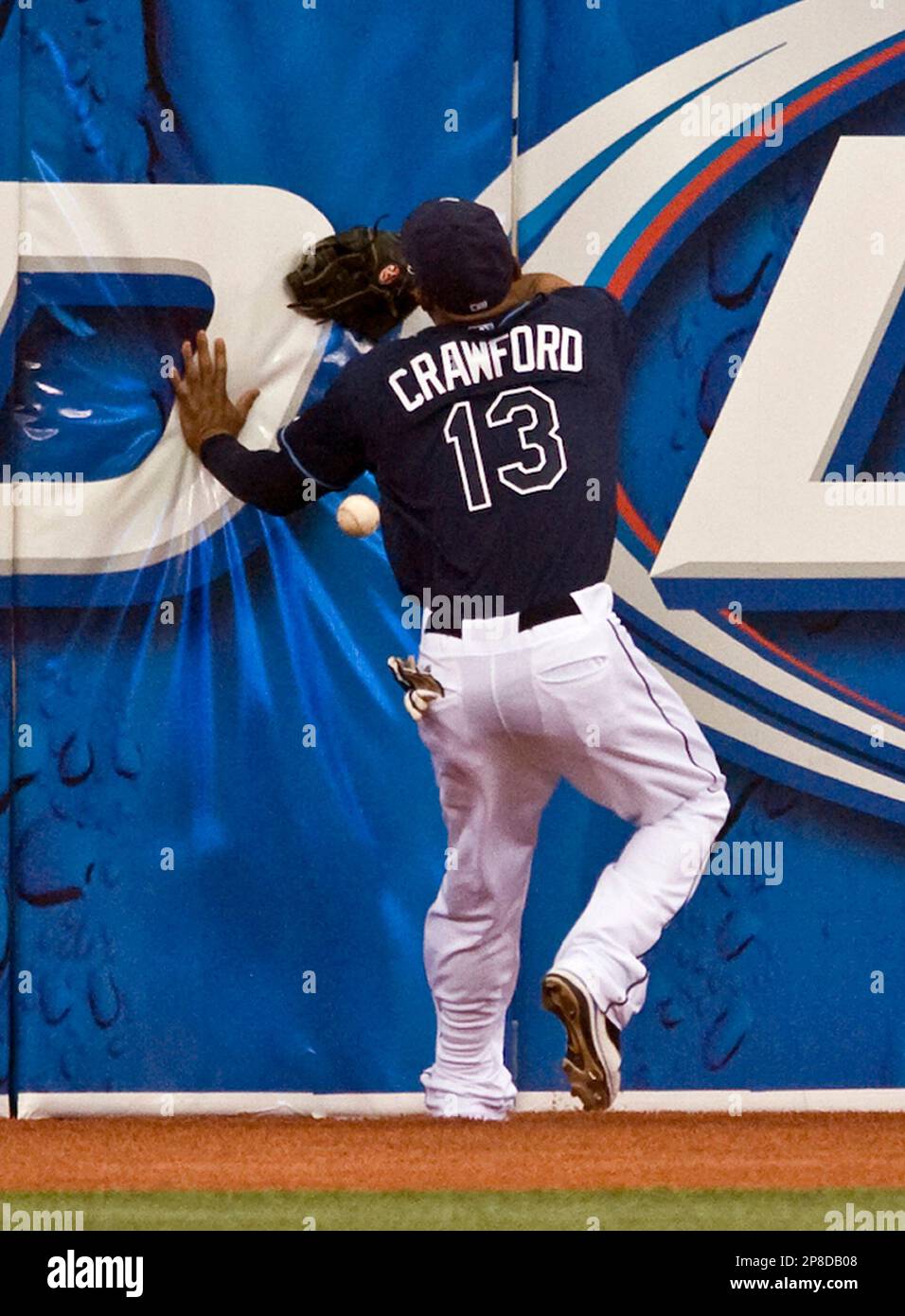 Tampa Bay Rays left fielder Carl Crawford misses at the wall a double ...