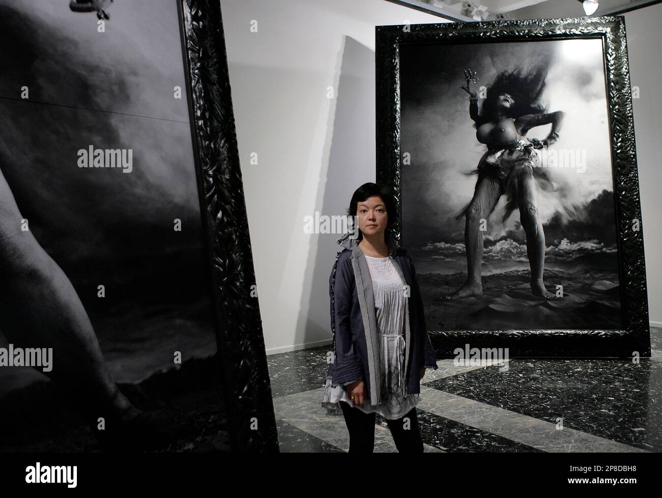 Japanese artist Miwa Yanagi poses next to her "Windswept Women" at the ...
