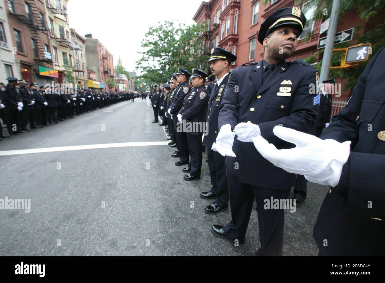 Police officers line the streets as they prepare for the funeral of ...