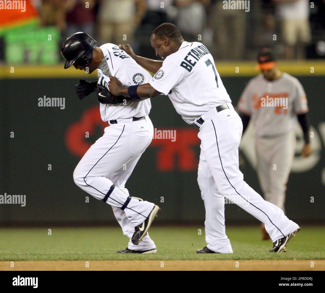 Seattle Mariners' Adrian Beltre, left, is congratulated by teammate ...