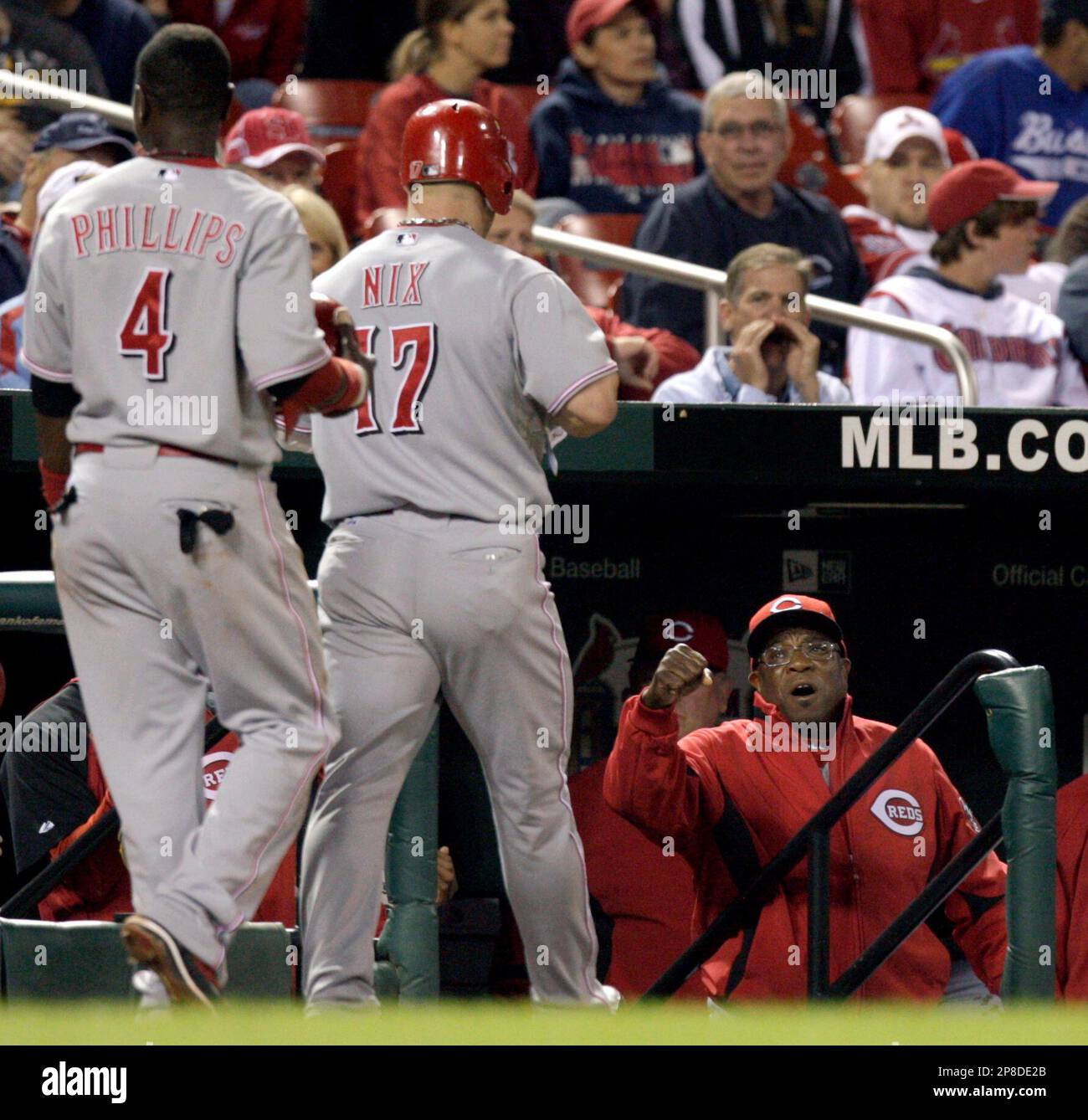 Cincinnati Reds manager Dusty Baker, right, waits in the dugout to ...