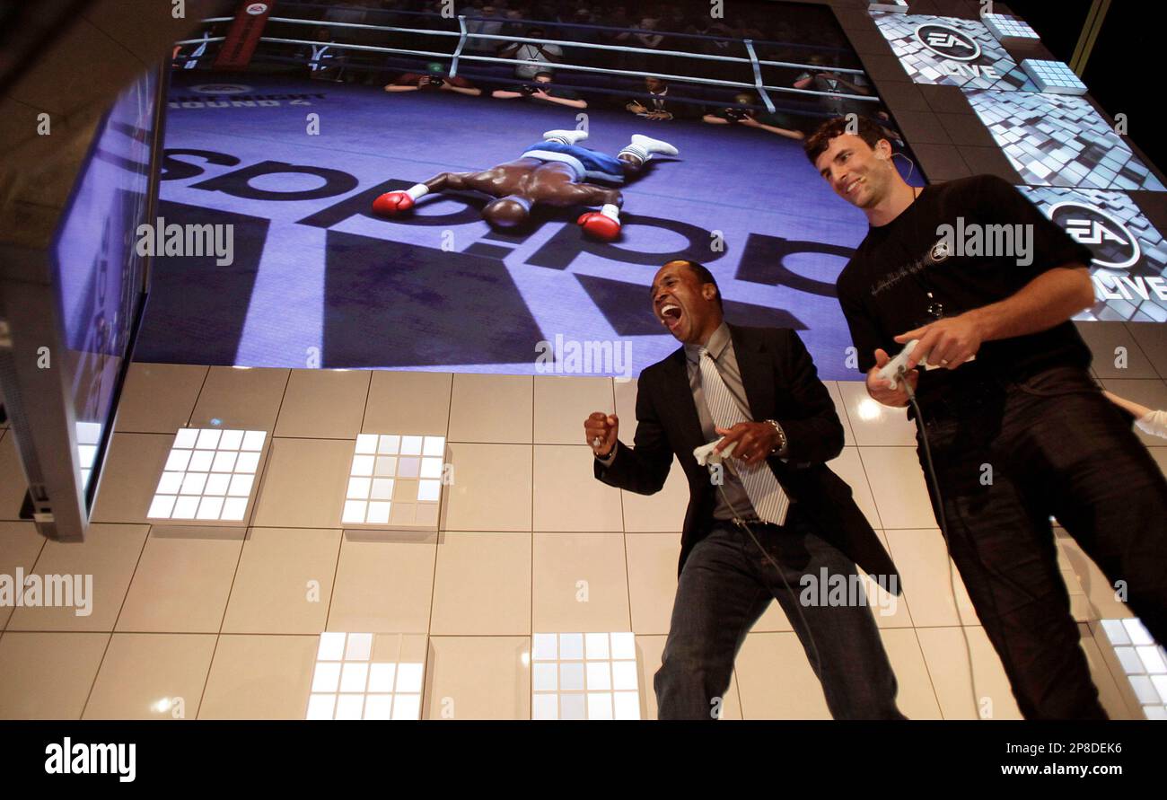 Former boxing champion Sugar Ray Leonard and gamer Mike Mahar, right ...