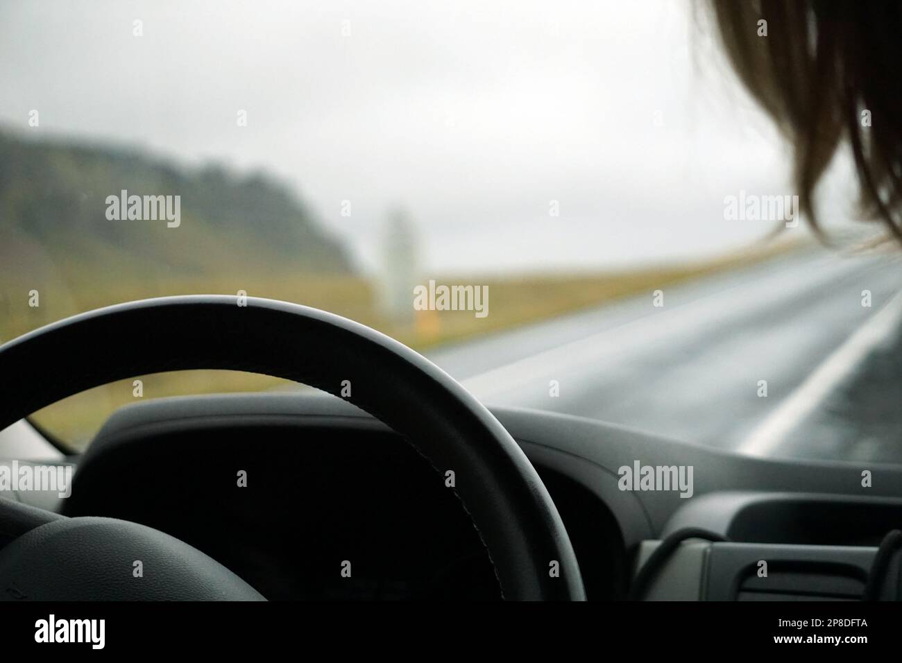 Driving a car - perspective of a driver - bokeh effect Stock Photo - Alamy