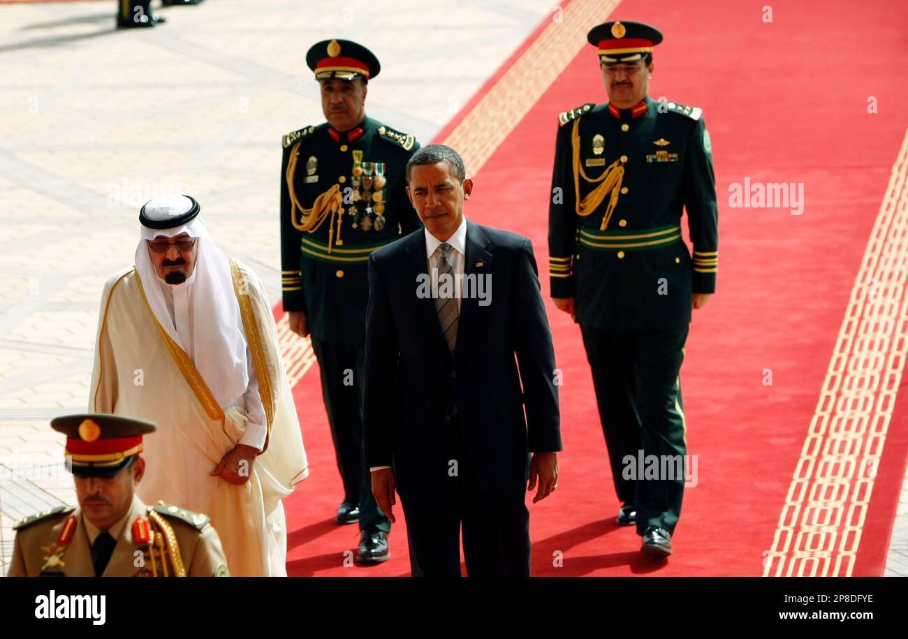 U.S. President Barack Obama walks with Saudi King Abdullah as he ...