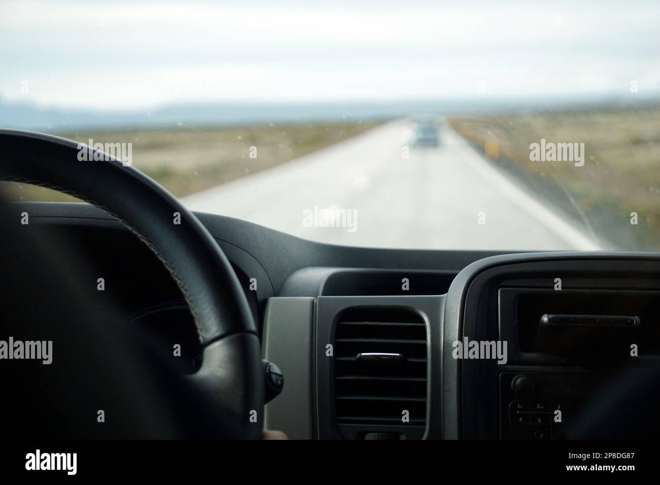 Driving a car - perspective of a driver - bokeh effect Stock Photo - Alamy