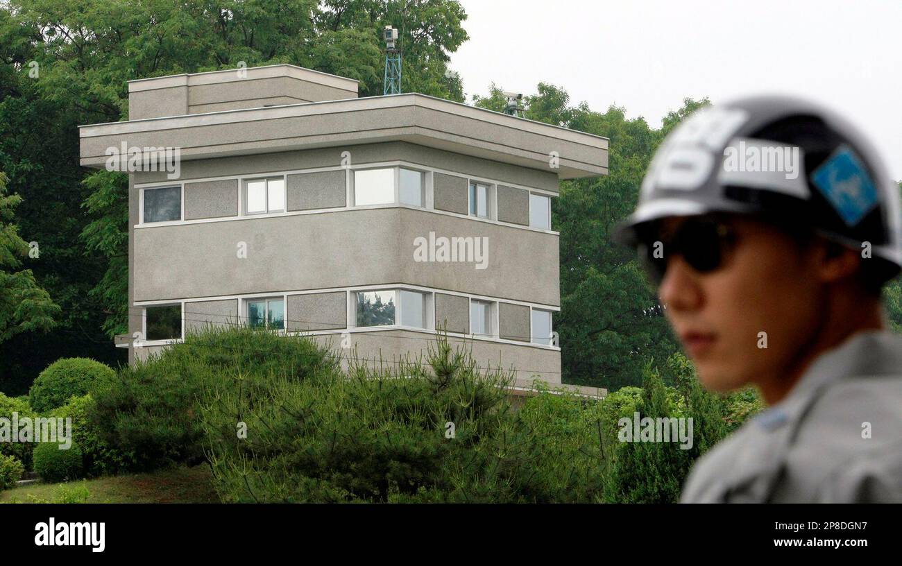 A North Korean military checkpoint is seen as a South Korean soldier ...