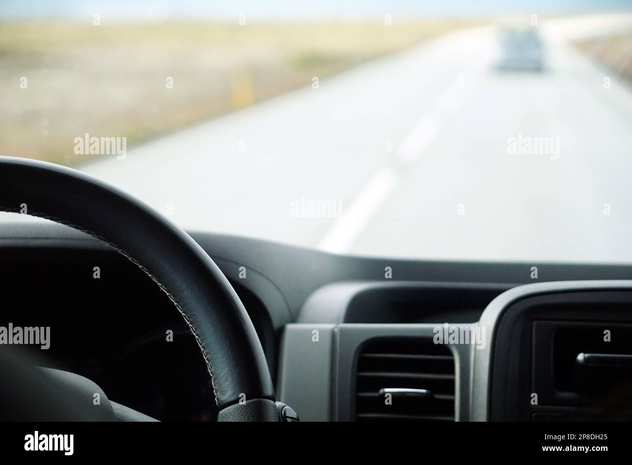 Driving a car - perspective of a driver - bokeh effect Stock Photo - Alamy