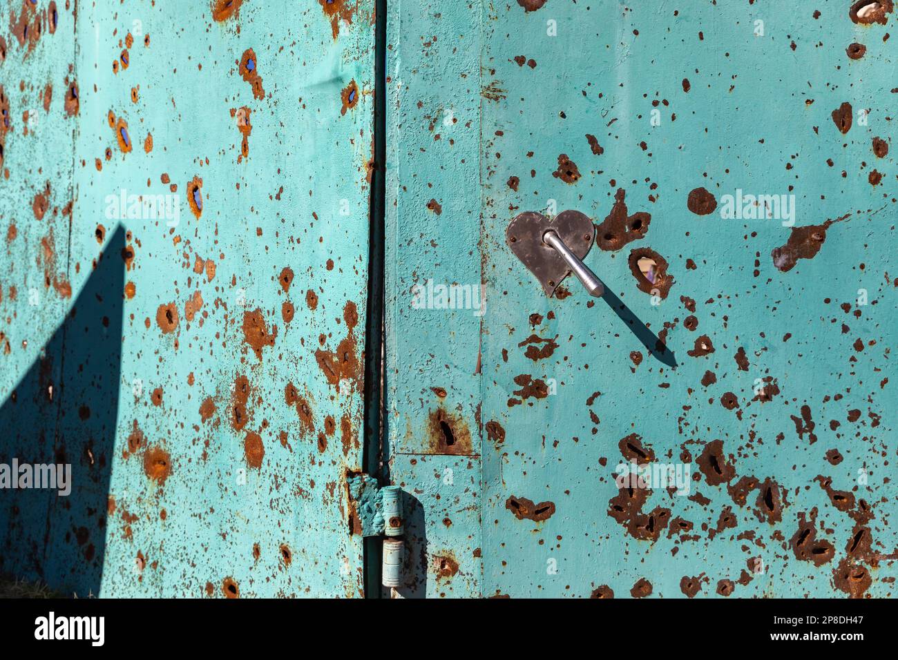 The surface of the metal gates is covered with splinter marks from ...