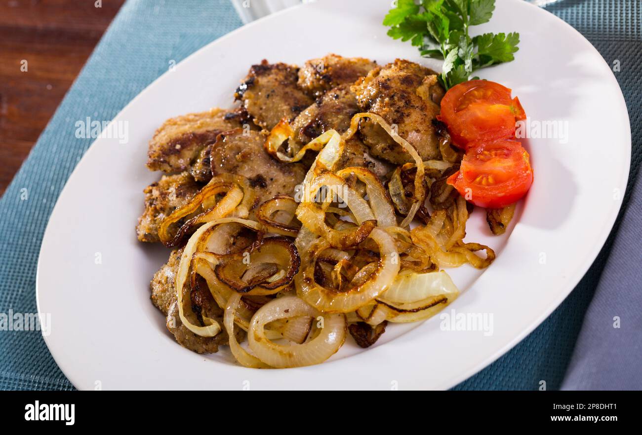 Fried rabbit liver with onion Stock Photo - Alamy