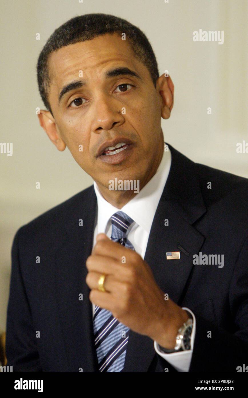 President Barack Obama gestures while meeting with Senate Democrats to ...