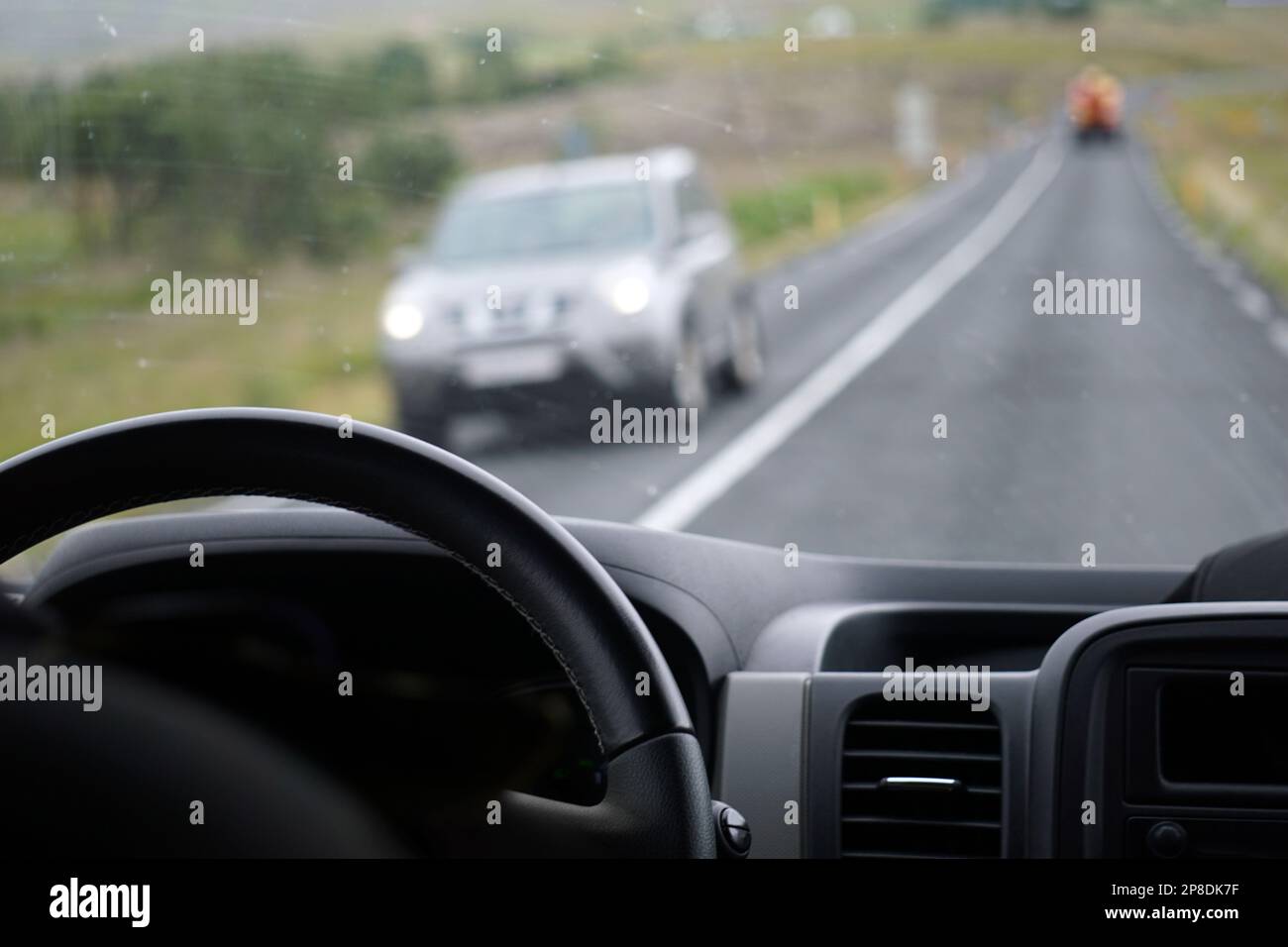 Driving a car - perspective of a driver - bokeh effect Stock Photo - Alamy