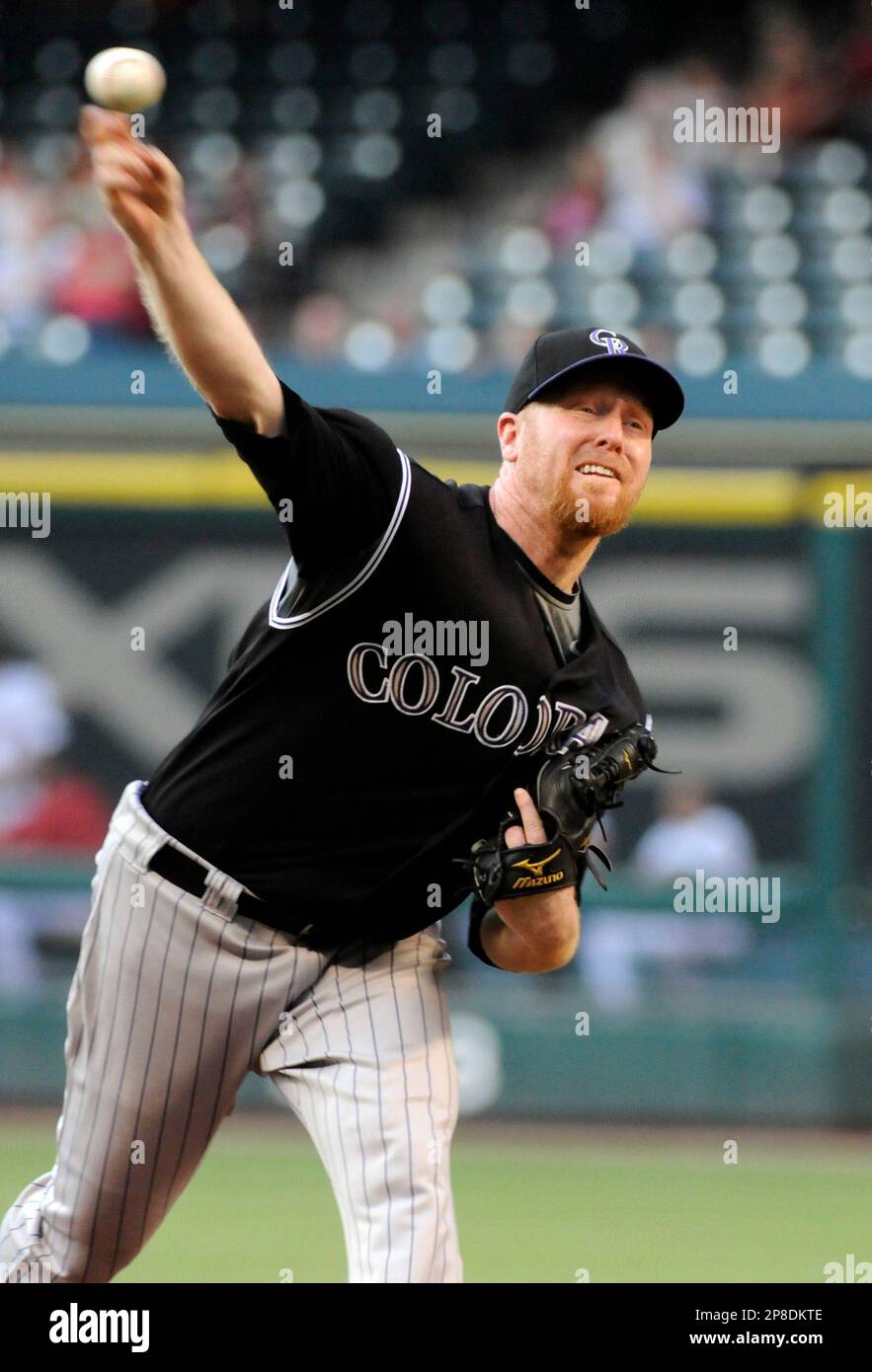Colorado Rockies' Aaron Cook delivers a pitch in the first inning ...