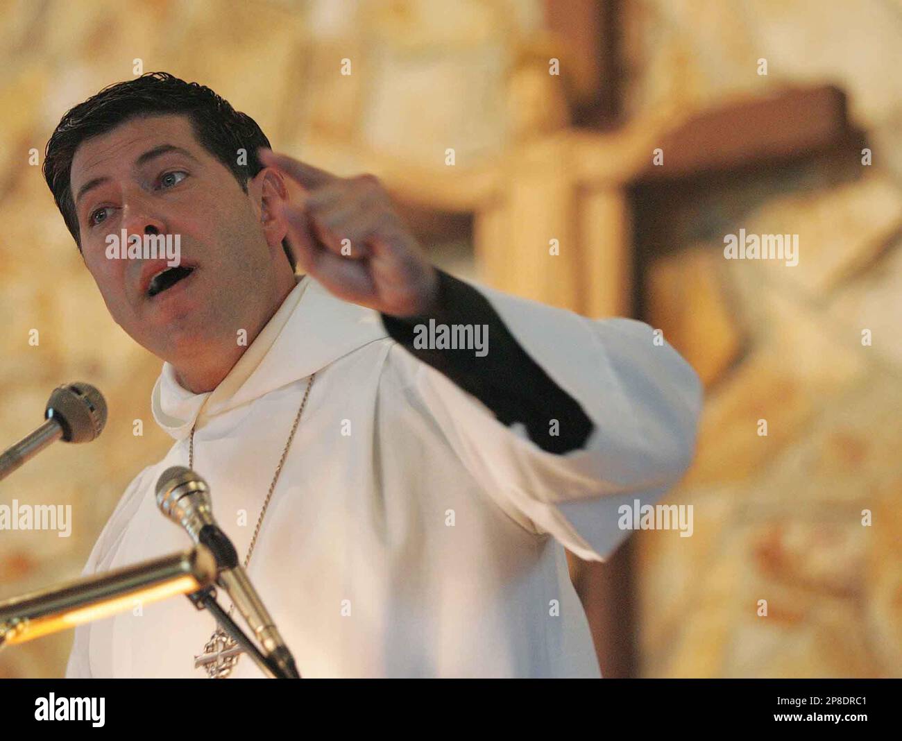 Father Alberto Cutie offers his first sermon at his new congregation at ...