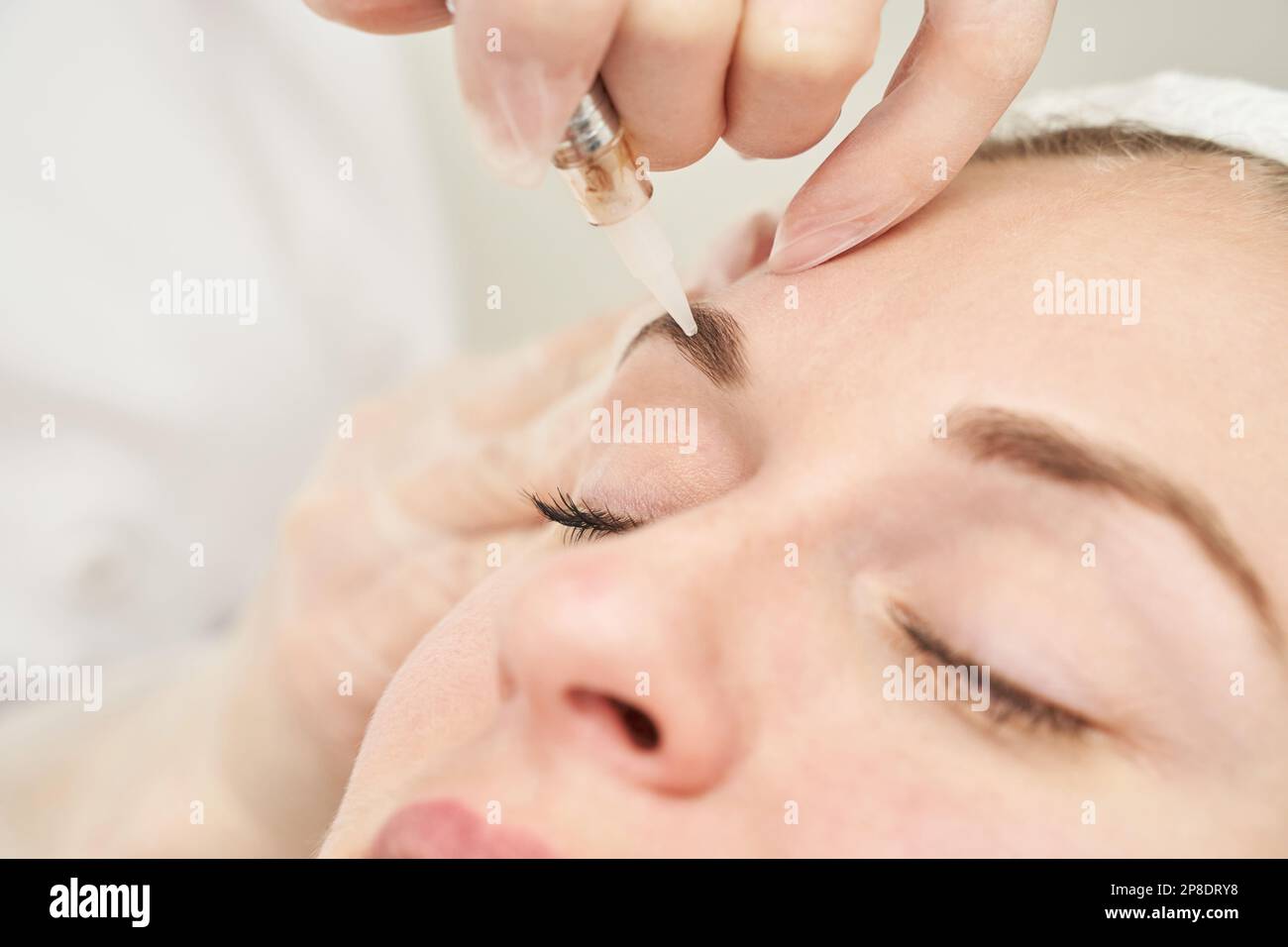 Permanent makeup. Beauty spa procedure. young woman. Face tattoo. Eye ...