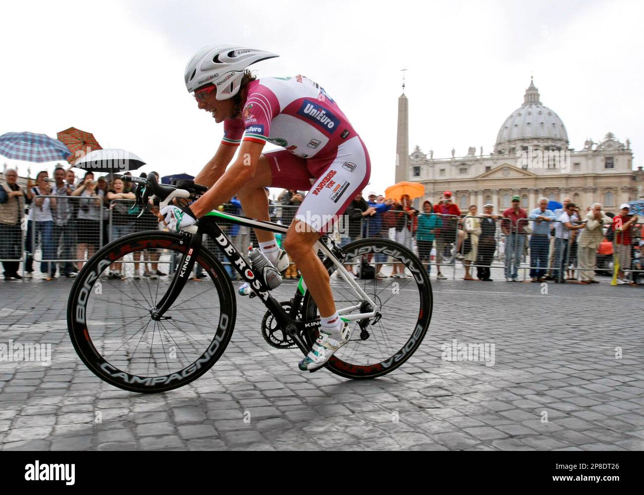 Italy's Danilo Di Luca pedals past St. Peter's Basilica, during the ...