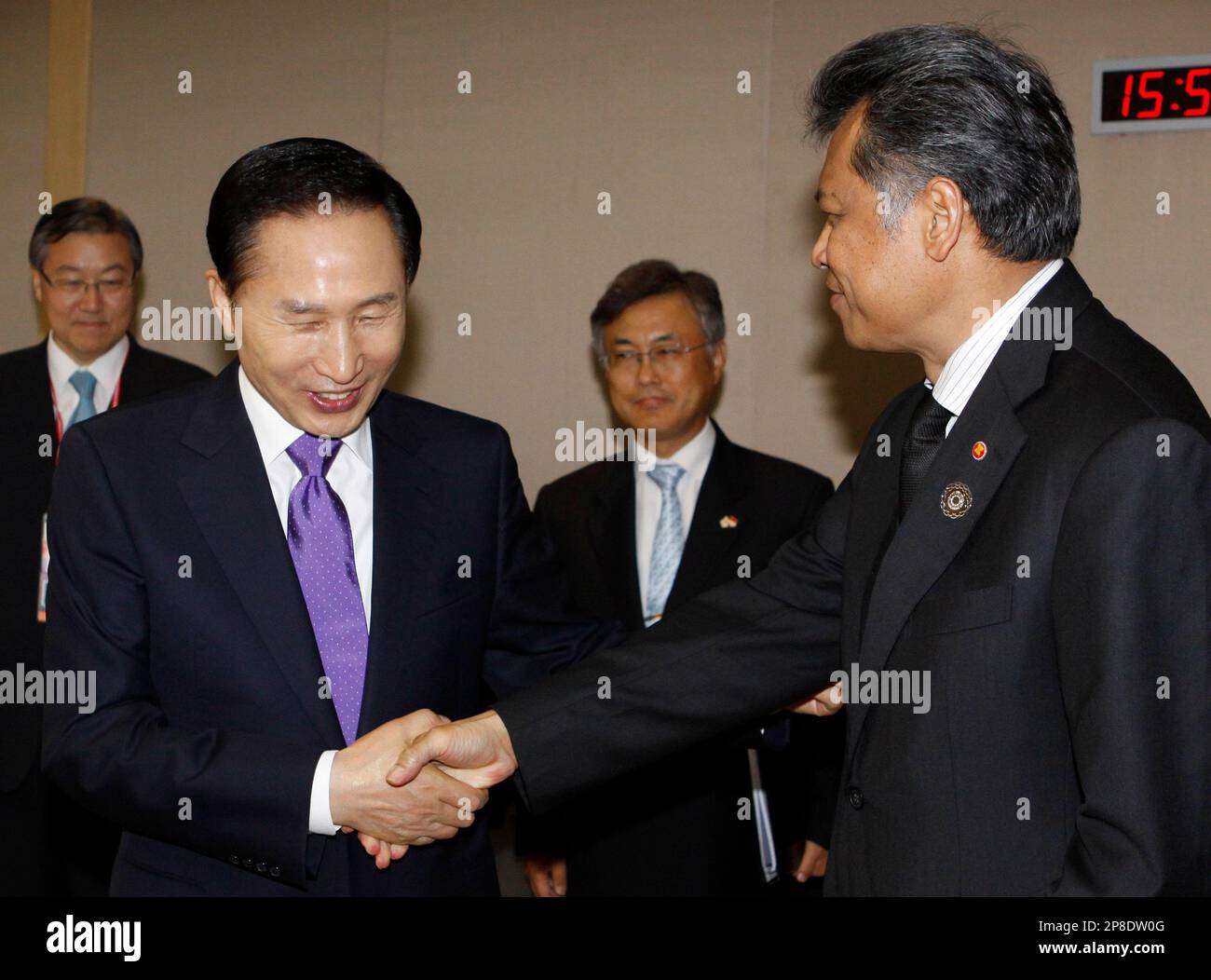 South Korean President Lee Myung-bak, left, greets Surin Pitsuwan ...