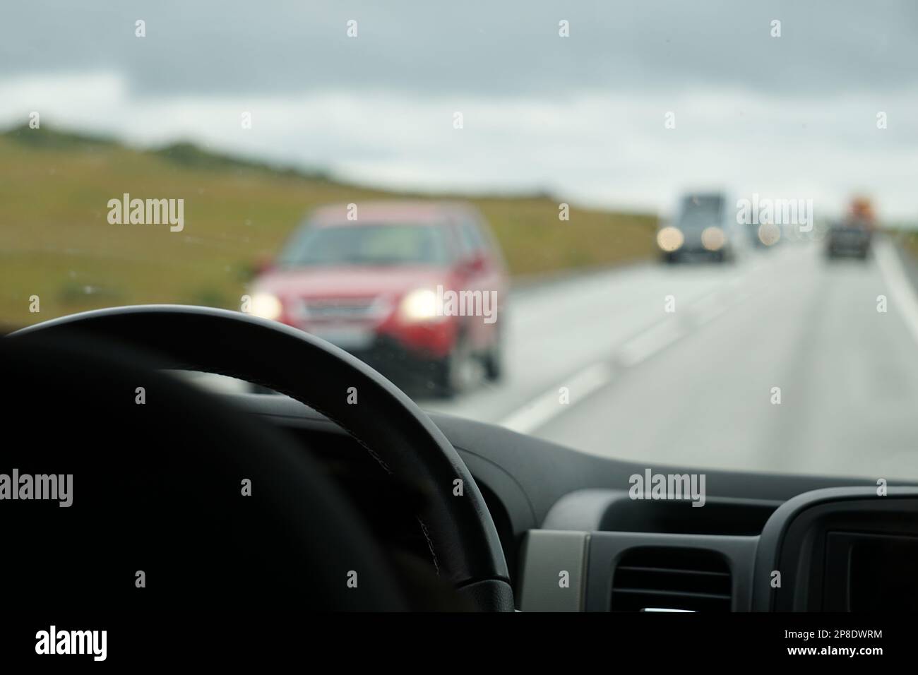 Driving a car - perspective of a driver - bokeh effect Stock Photo - Alamy