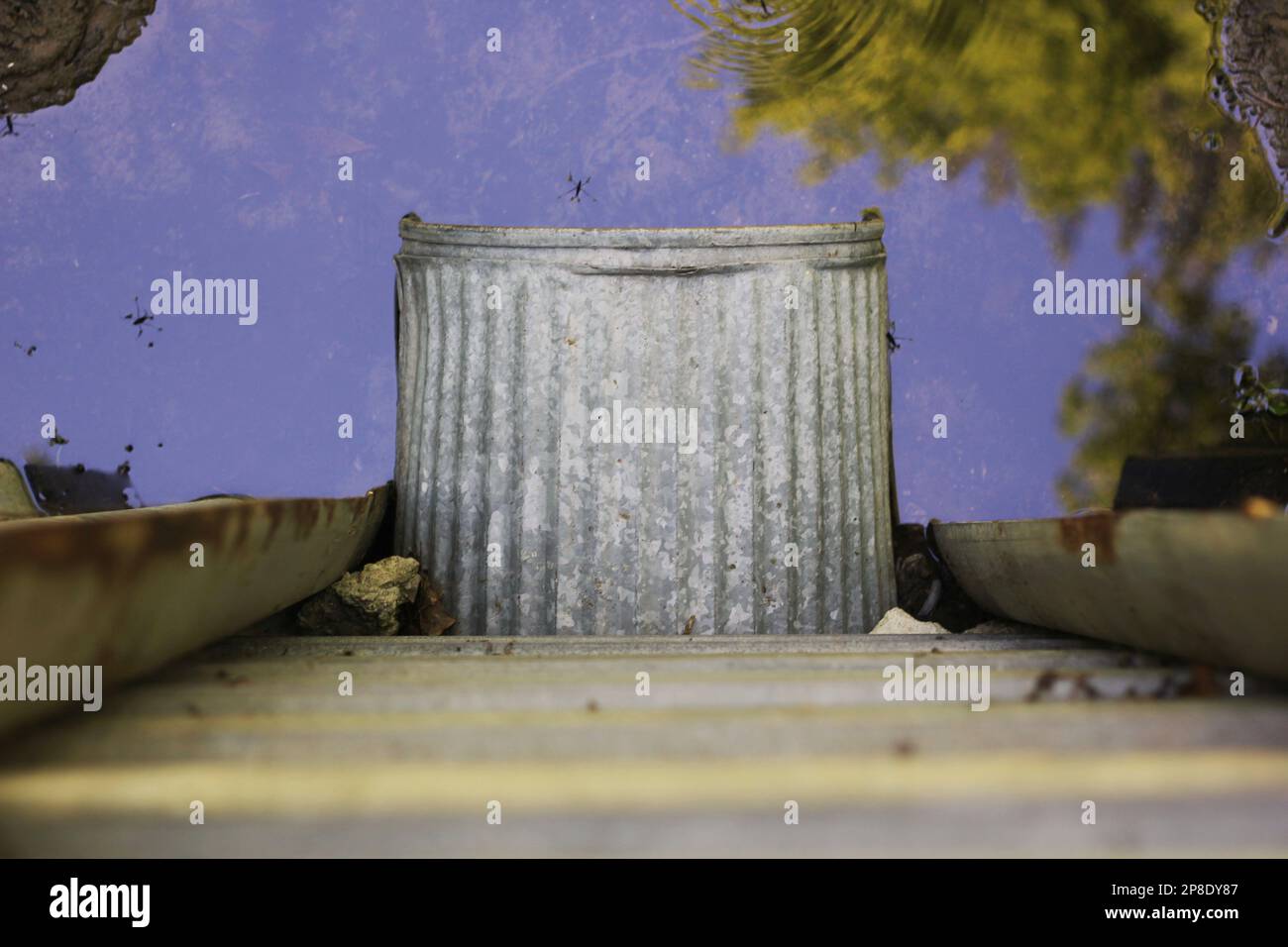 A corrugated steel drainage channel used to divert excess water under ...