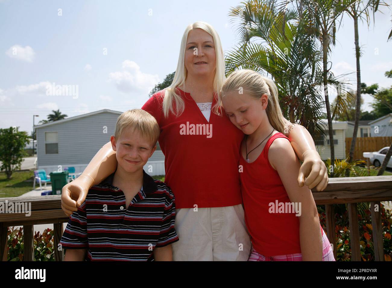 Lisa Strong with her children, Chloe, right, and Jesse left, pose for ...