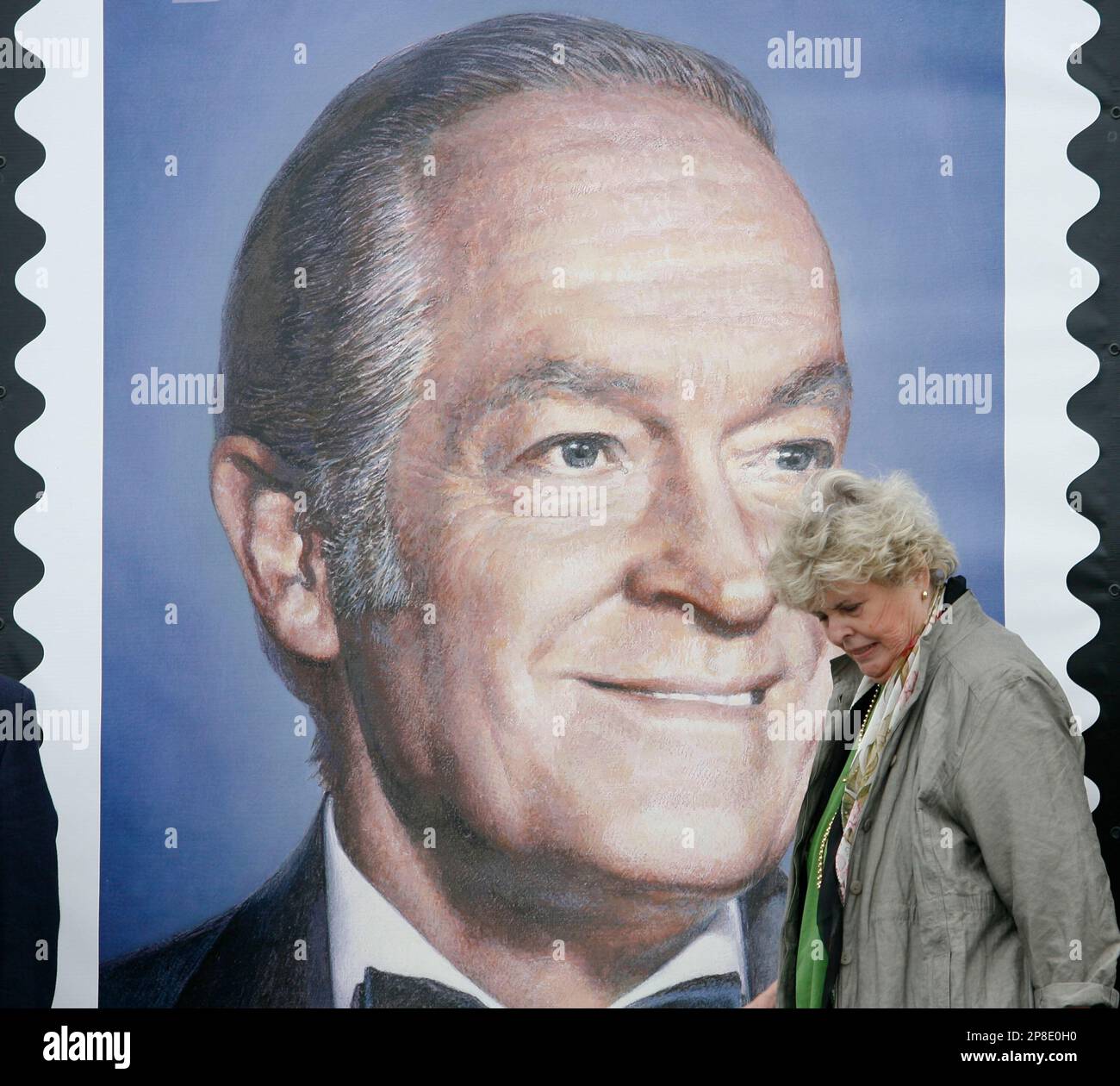 Linda Hope, daughter of Bob Hope, walks past a 44-cent U.S. postage ...