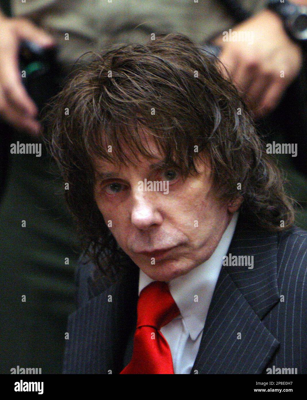 Music producer Phil Spector sits in a courtroom for his sentencing in ...
