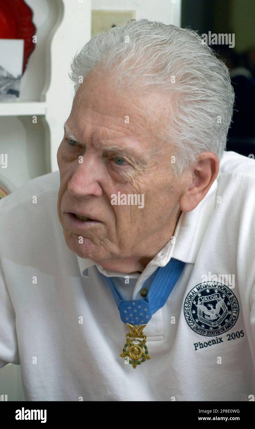 Medal of Honor recipient Frank Currey speaks with a reporter at the ...