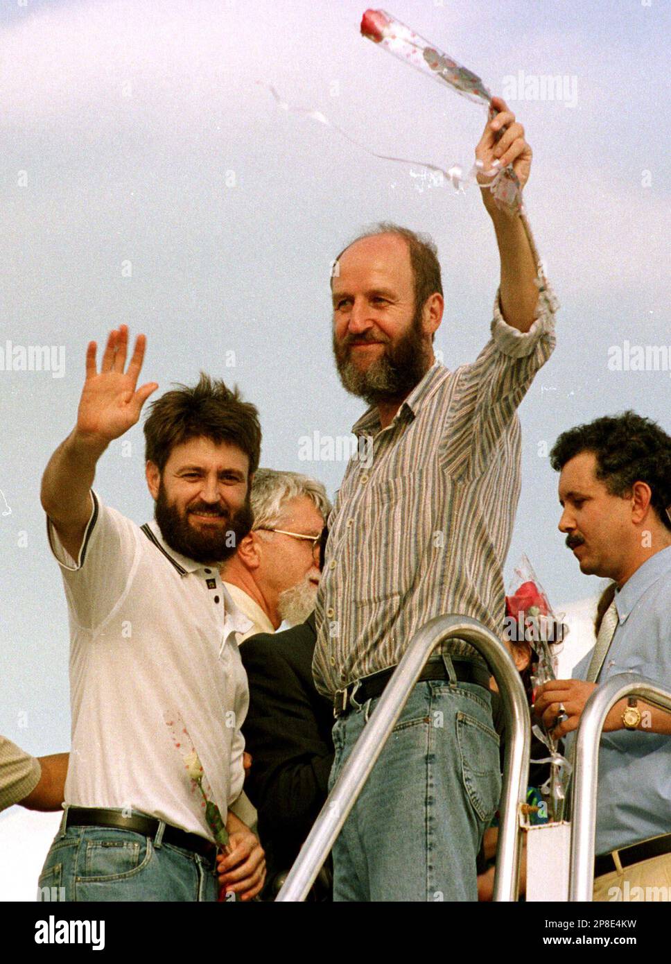 FILE - Freed South African hostage Callie Strydom, left, and German ...