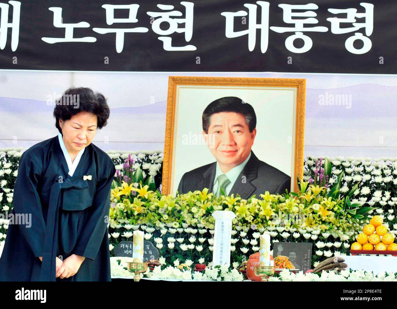 Kwon Yang-sook, a wife of former President Roh Moo-hyun, mourns in a ...
