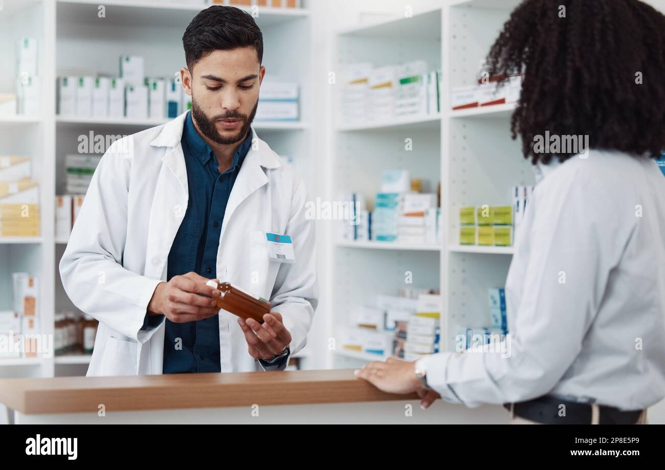 Pharmacy, man and customer with medicine, instructions and conversation ...