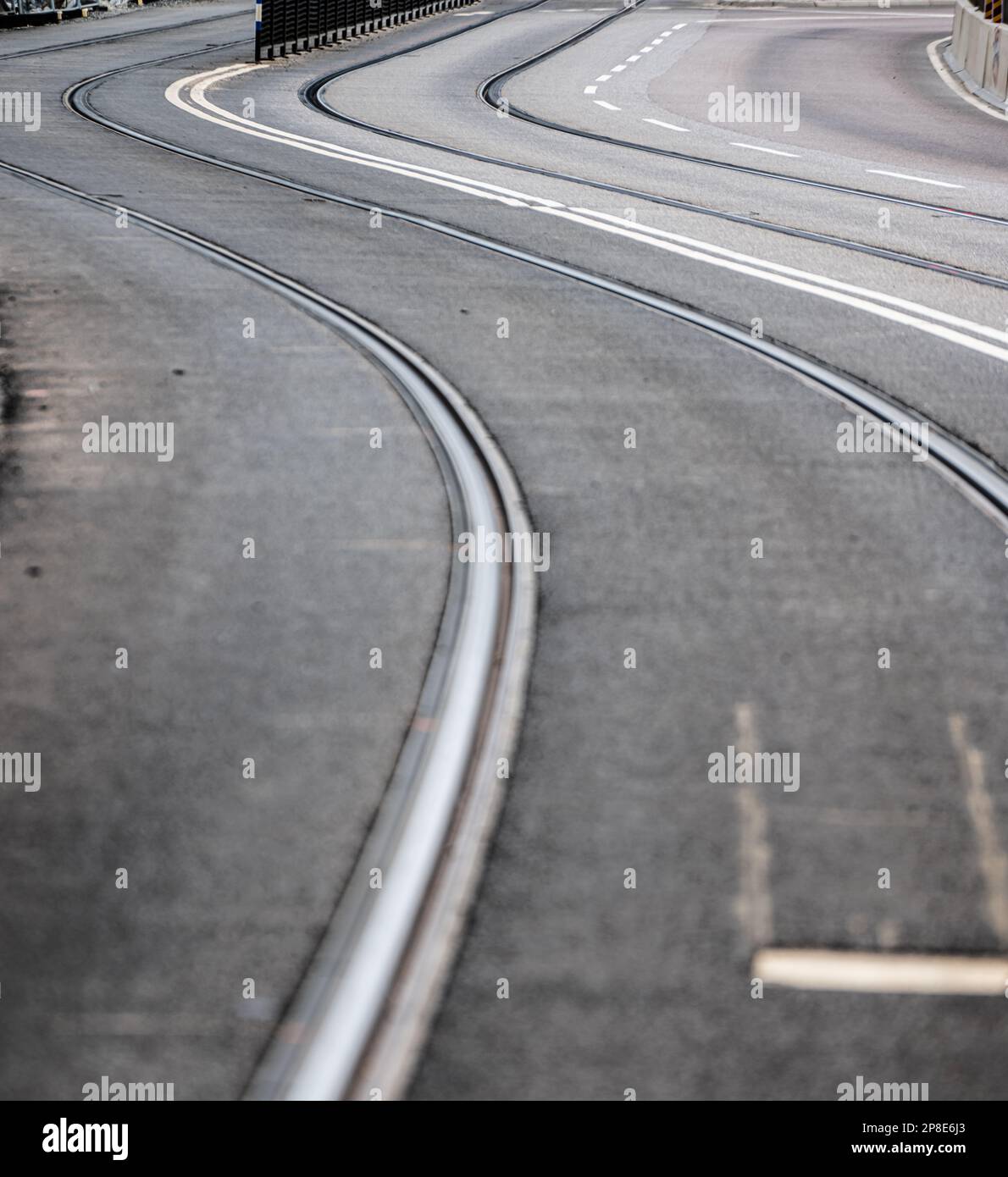 Tram track curve on asphalt road Stock Photo - Alamy