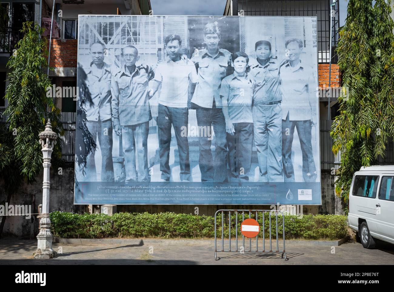 A large photograph showing 7 of the 12 survivors in a courtyard at the ...