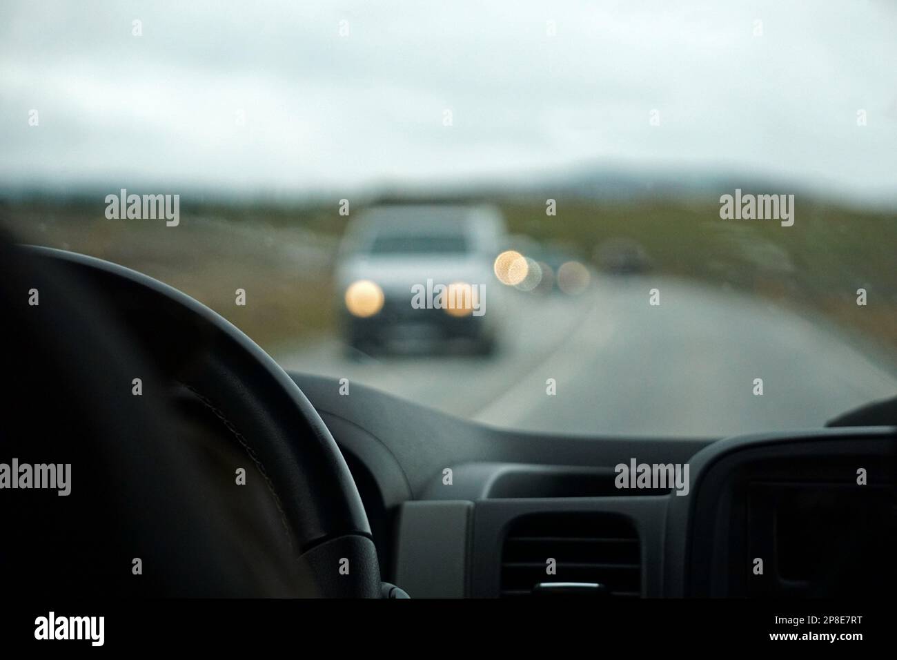 Driving a car - perspective of a driver - bokeh effect Stock Photo - Alamy