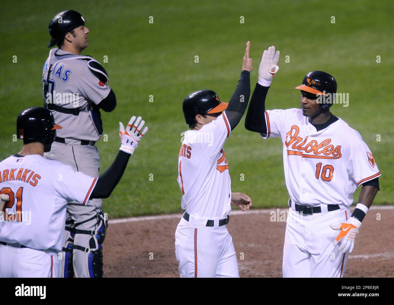 Baltimore Orioles' Adam Jones (10) celebrates his two-run home run with ...