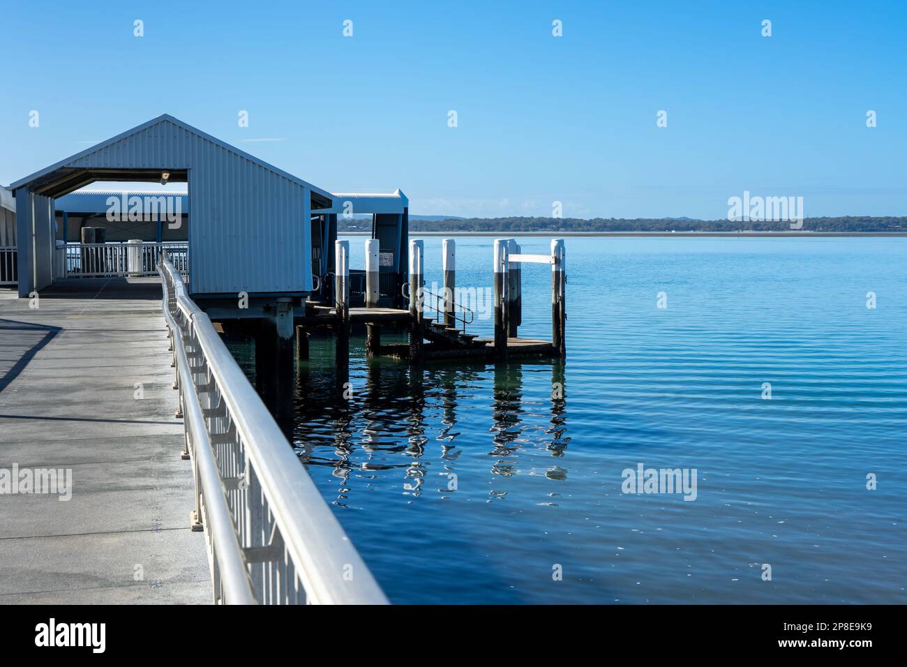 Early-morning view of Victoria Point Jetty, with calm seas and Bay ...