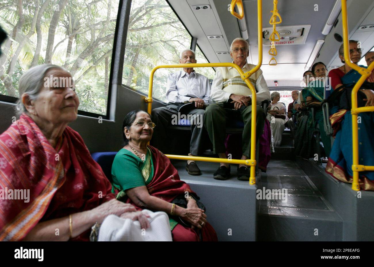 Elderly citizens are seen onboard a public bus during an 'Elders Day ...