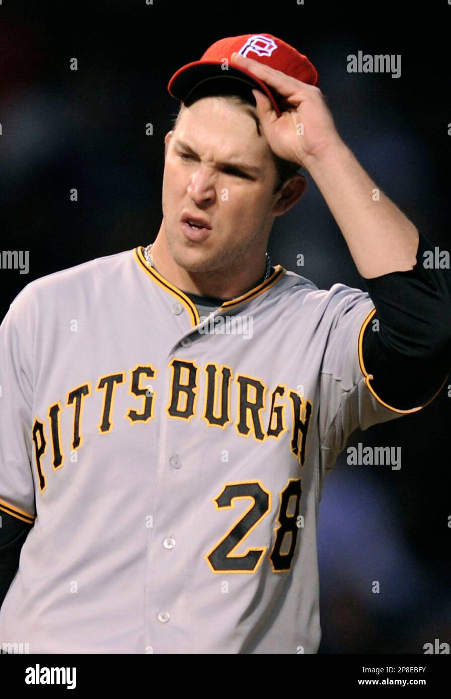 Pittsburgh Pirates starting pitcher Paul Maholm reacts to giving up ...