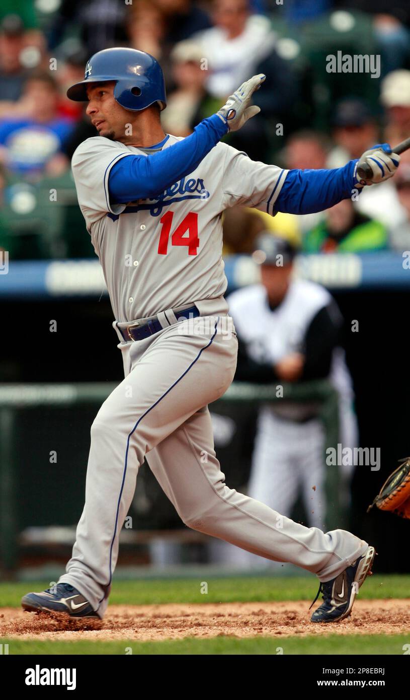 Los Angeles Dodgers' Juan Castro follows the flight of his two-run ...