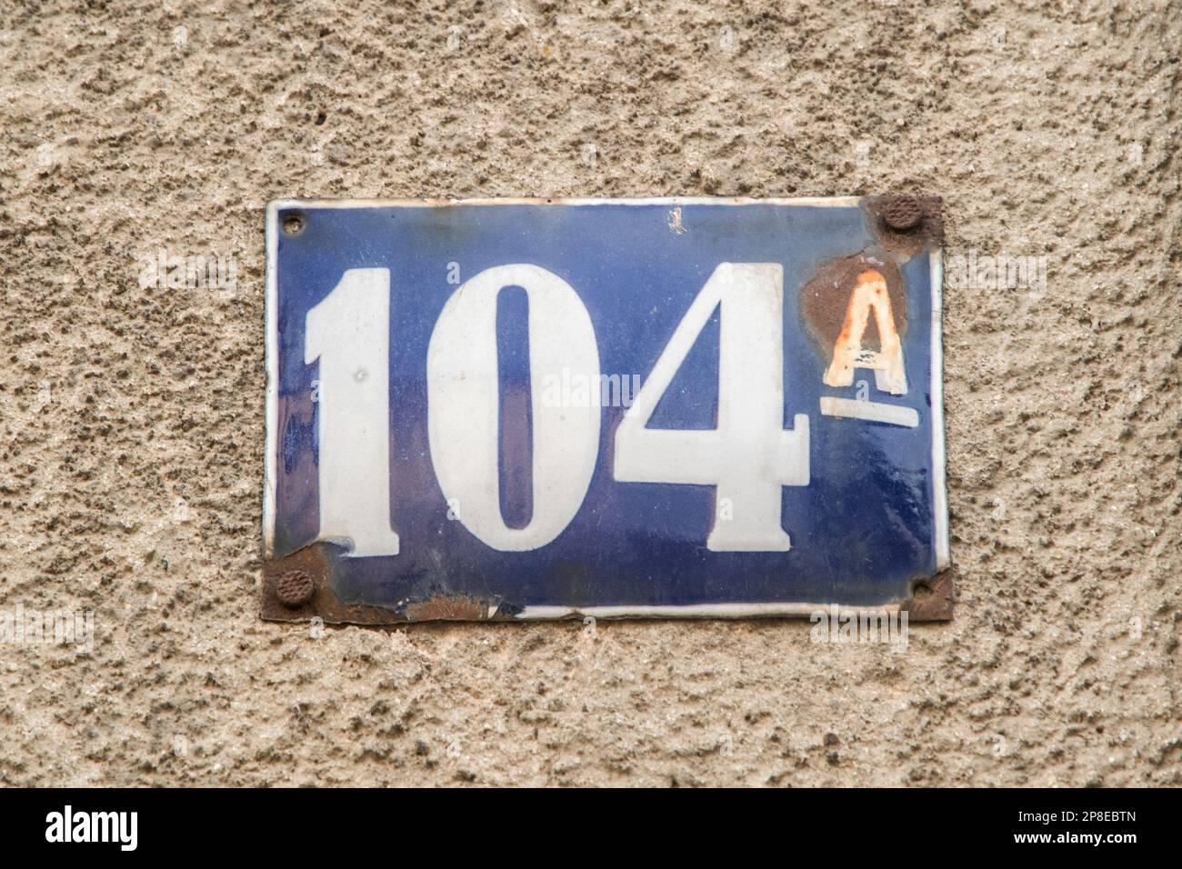 Weathered grunge square metal enameled plate of number of street ...