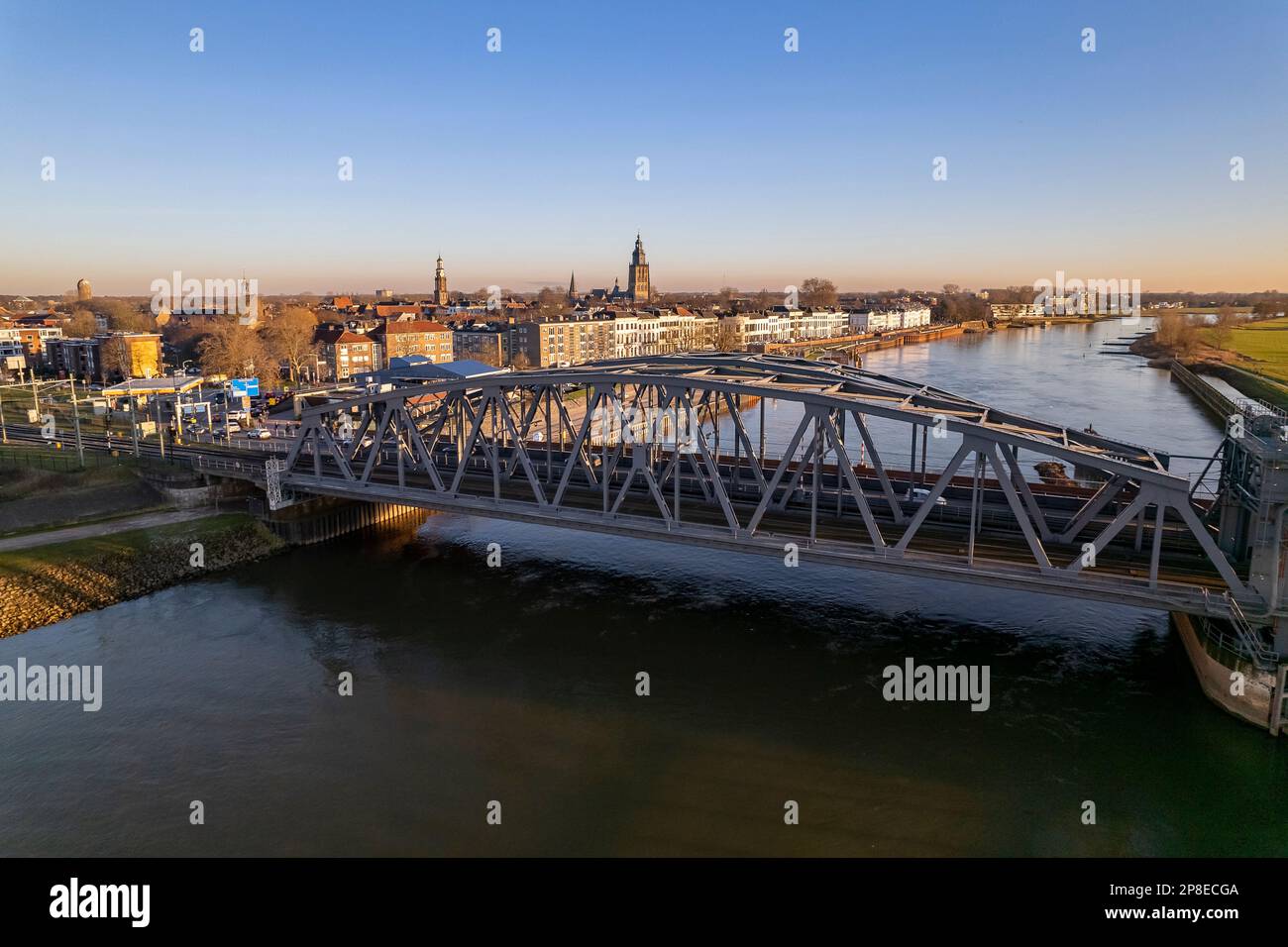 Steel draw bridge for train and traffic over the river IJssel with the ...