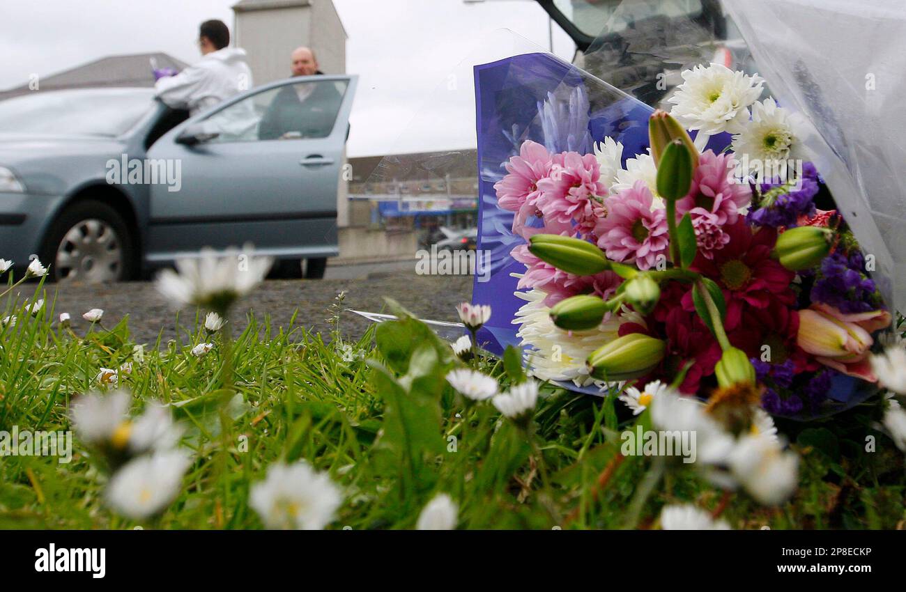 Flowers at the scene of a murder and an attempted murder in Coleraine ...