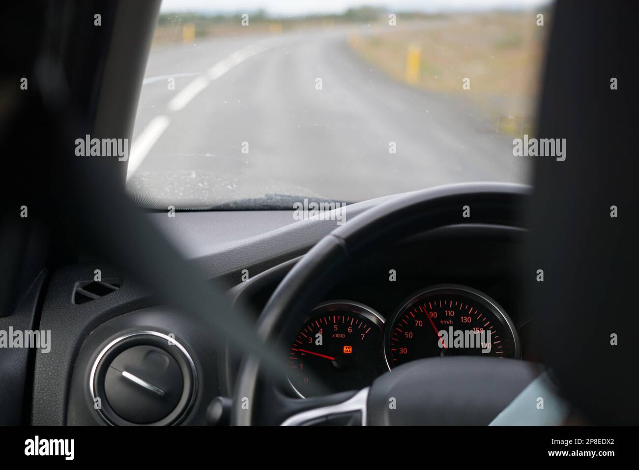 Driving a car - perspective of a driver and view on speedometer Stock ...