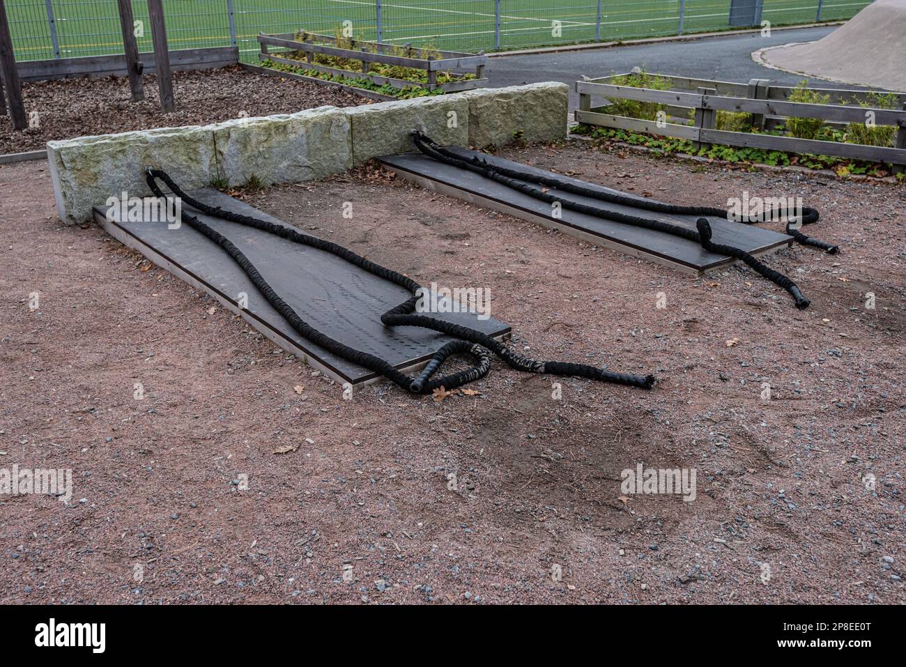 Rope training apparatus by a football field Stock Photo - Alamy