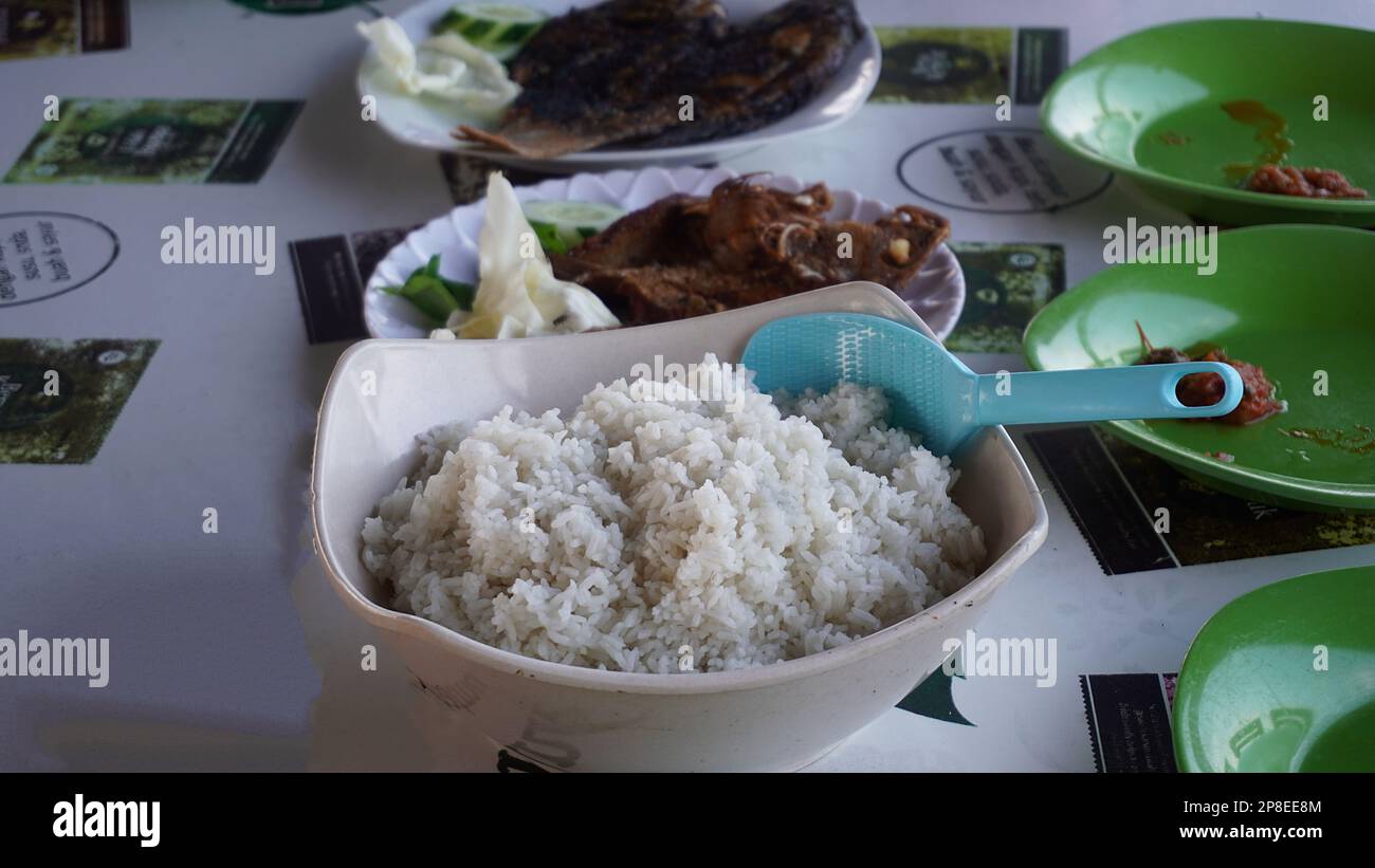 grilled chicken with rice and lime wedges Stock Photo - Alamy