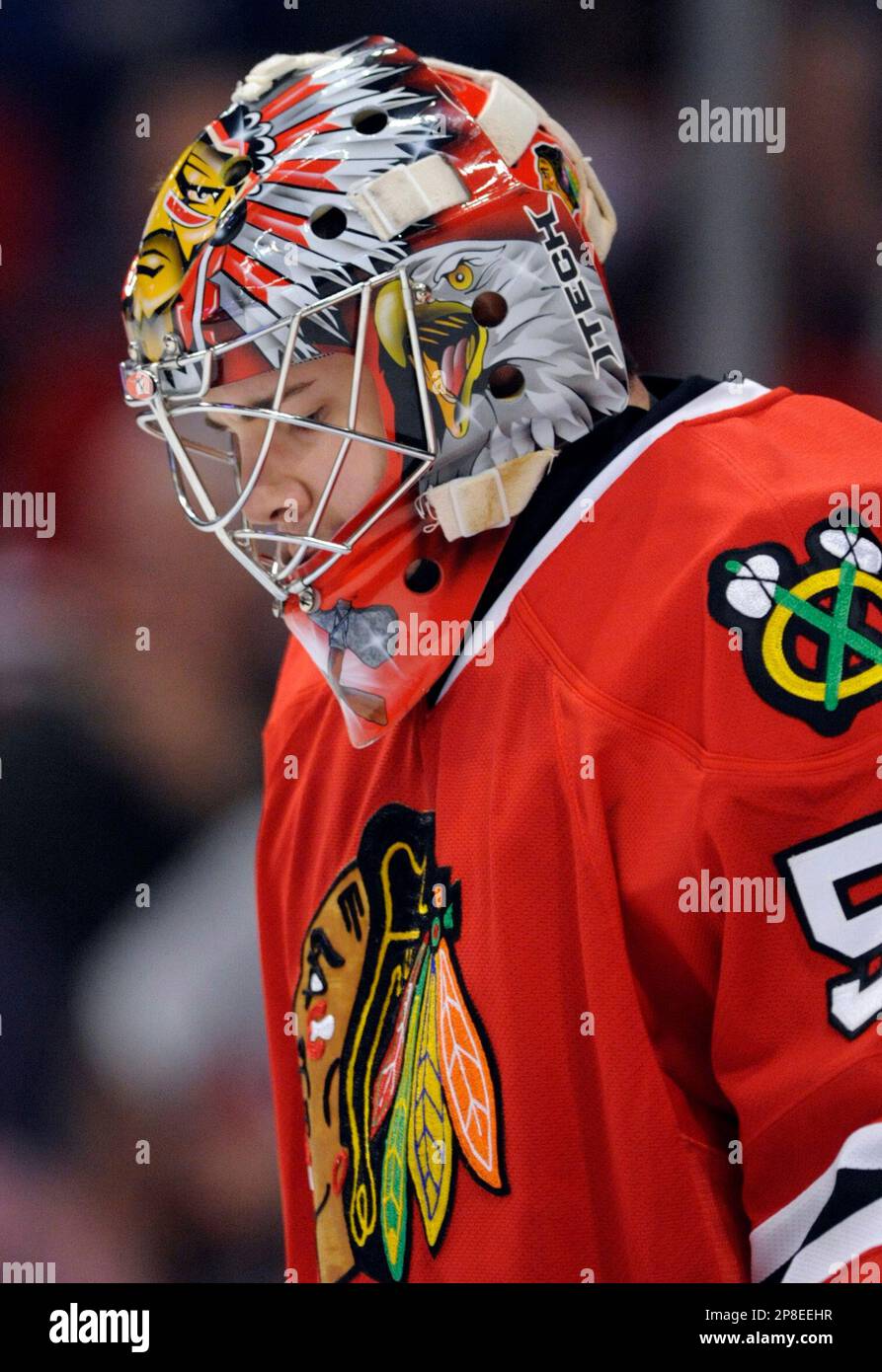 Chicago Blackhawks goalie Corey Crawford looks down during the second ...